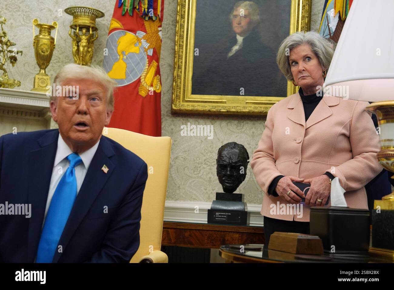 White House chief of staff Susie Wiles listens as President Donald ...