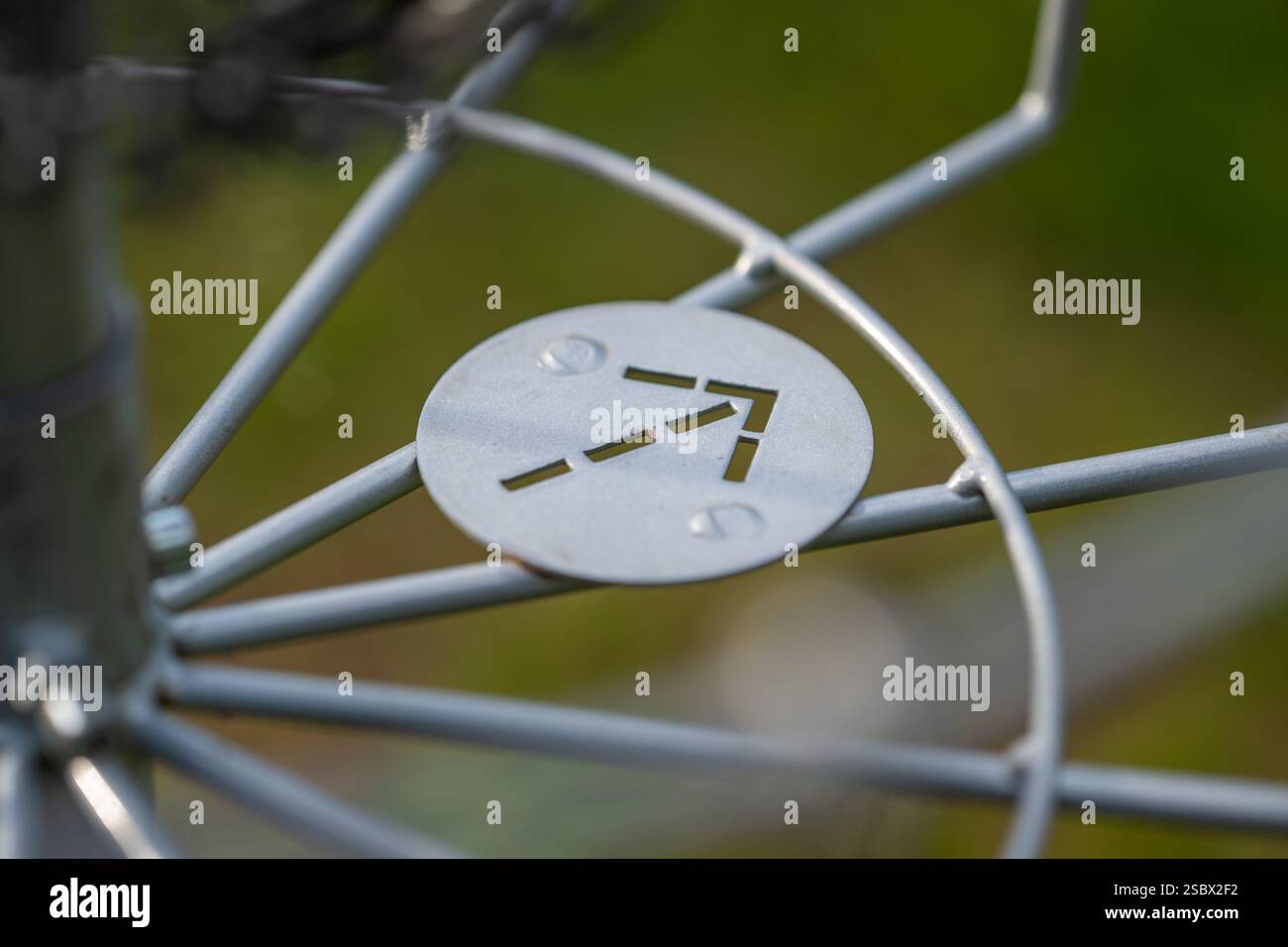 Arrow on a disc golf target showing the way to the next target Stock ...