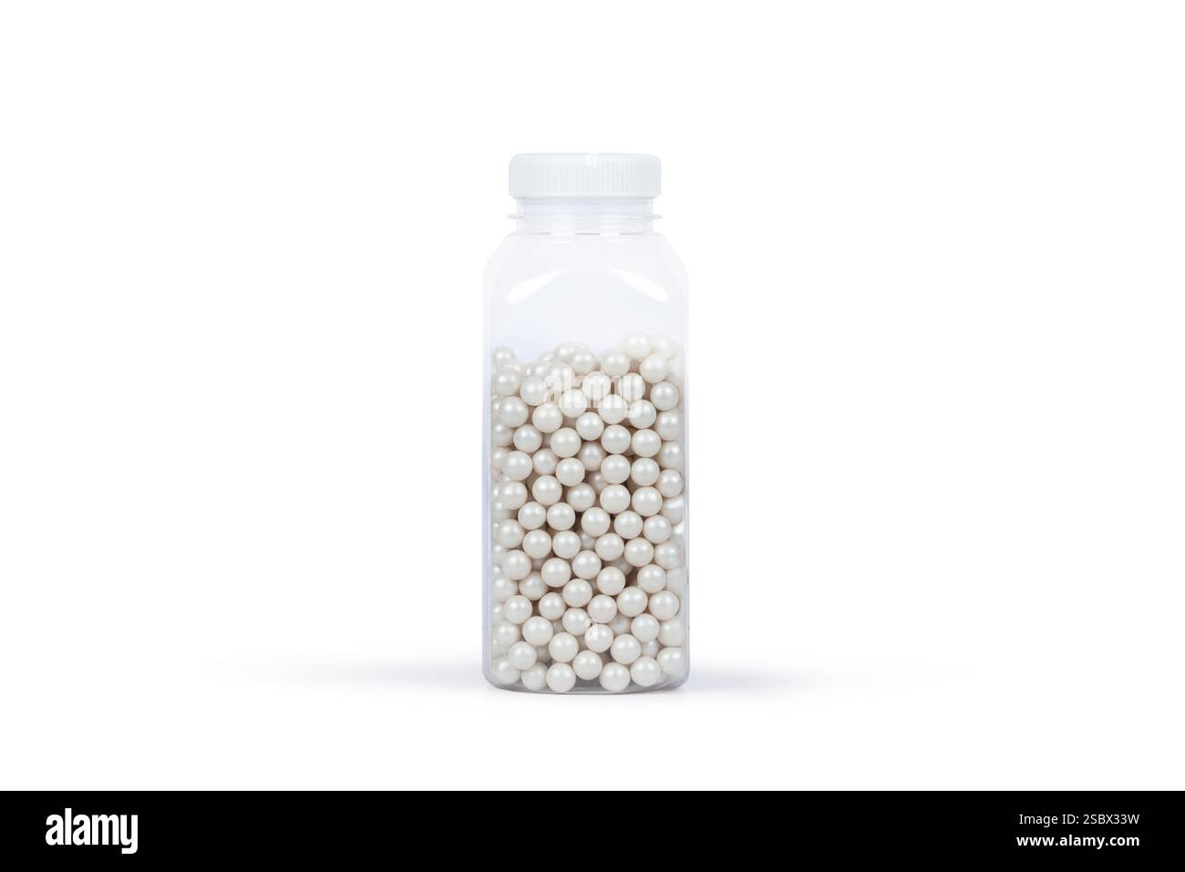 Transparent Plastic Bottle with White Spherical Pills on White ...