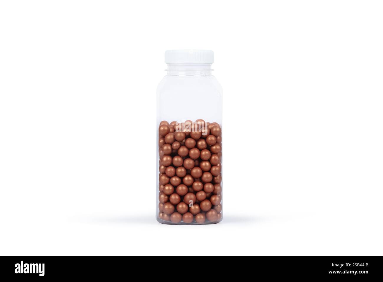 Transparent Plastic Bottle with Golden Spherical Pills on White ...