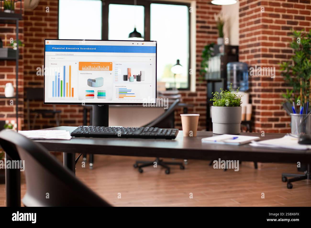 Vacant office desk holds computer displaying company research data on ...