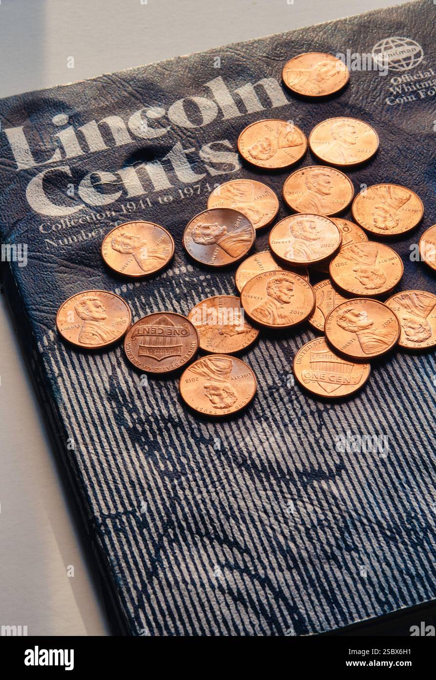 Still life of pennies on a vintage coin collection folder, United ...