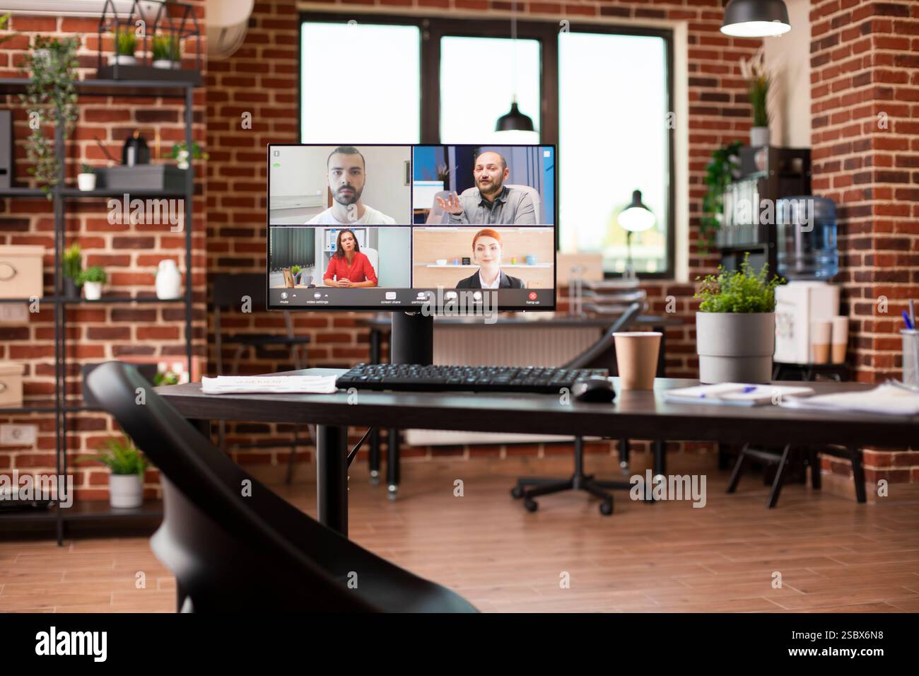 Vacant startup office with computer screen on clean desk shows virtual ...