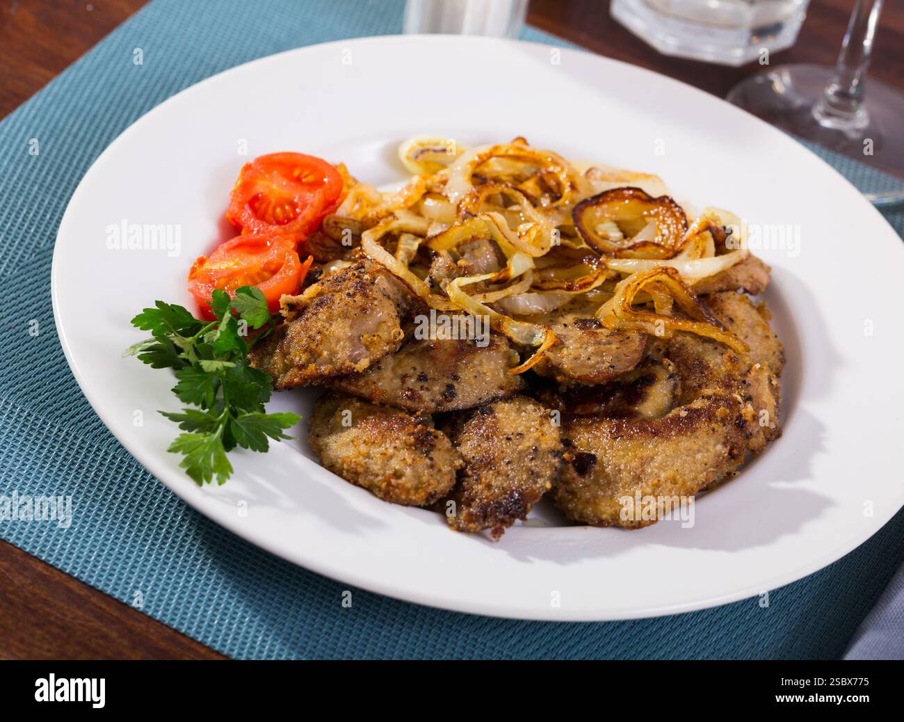 Fried rabbit liver with onion Stock Photo - Alamy