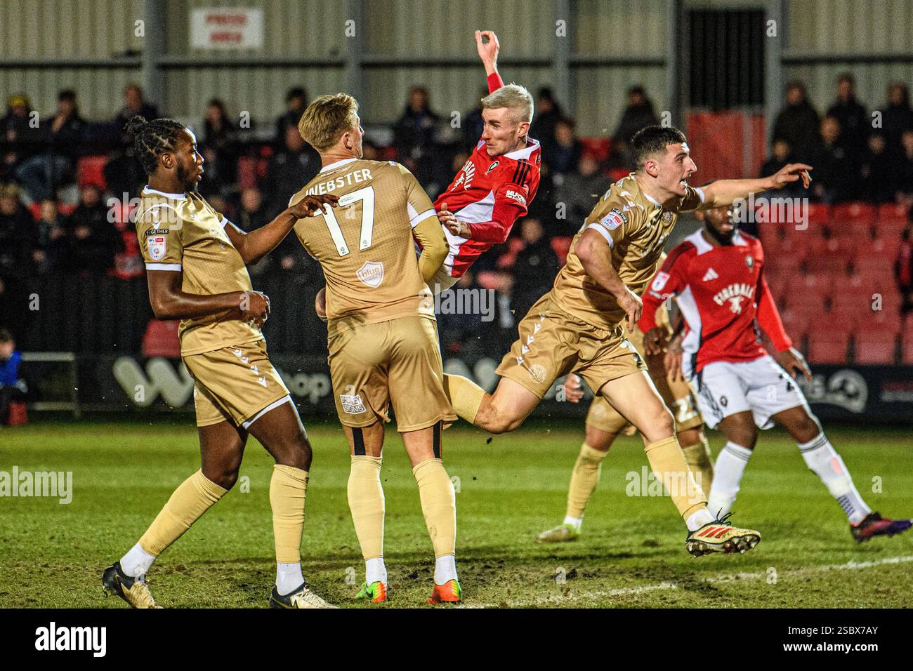Matty Lund of Salford City FC falls awkwardly after scoring this goal ...