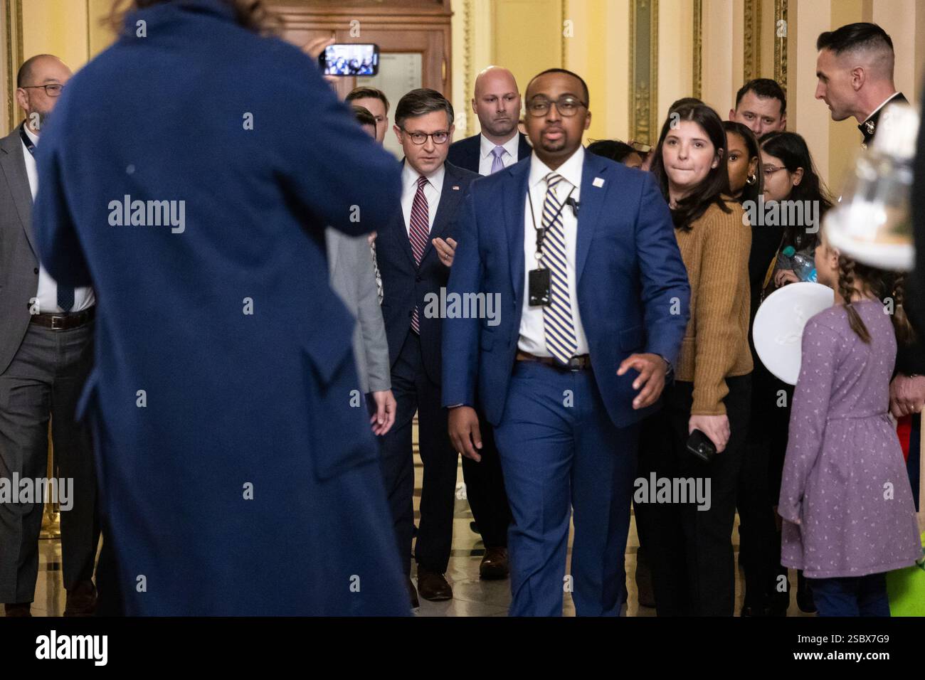 House Speaker Mike Johnson (R-La.) speaks with reporters as he walks to ...