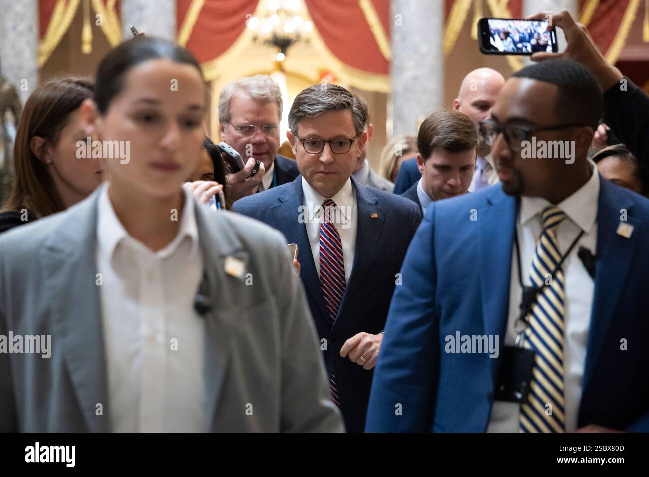 House Speaker Mike Johnson (R-La.) speaks with reporters as he walks to ...