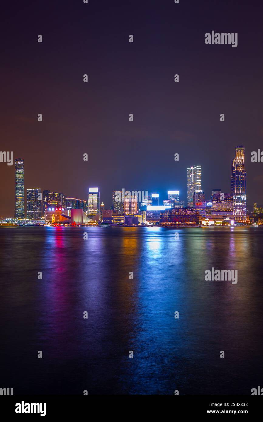 Nightfall on Victoria Harbour and the skyline of Kowloon Island in Hong ...