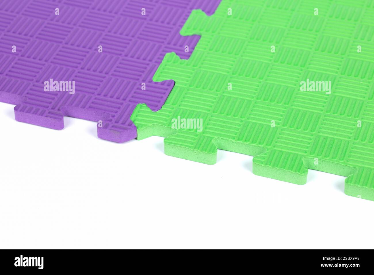 Green and Purple Interlocking Foam Mat Corner: Close-up Detail of ...