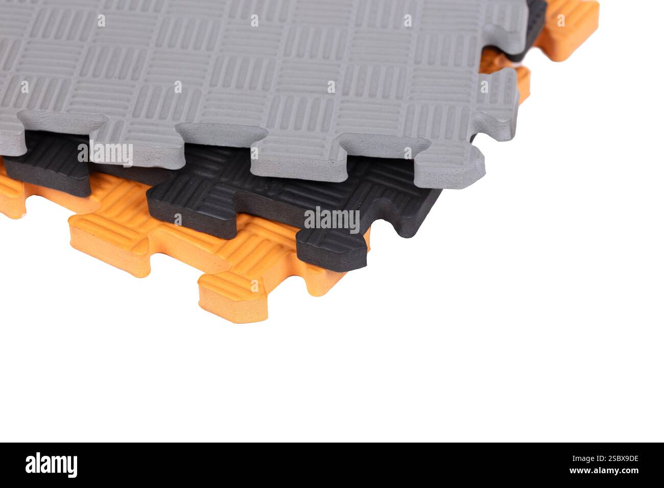 Orange and Black Interlocking Foam Exercise Mat Corner: Close-up Detail ...