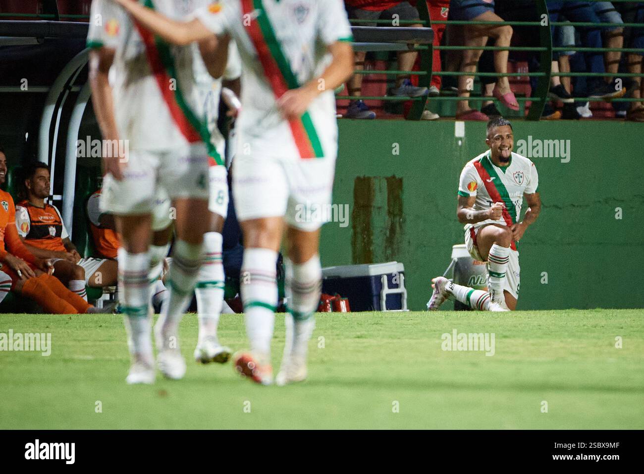 Renan Peixoto (R) of Portuguesa celebrates after scoring during the ...