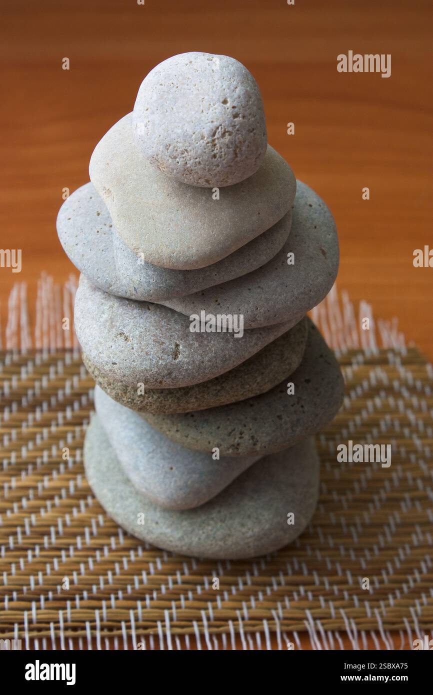 stones for spa massage isolated on white background Stock Photo - Alamy