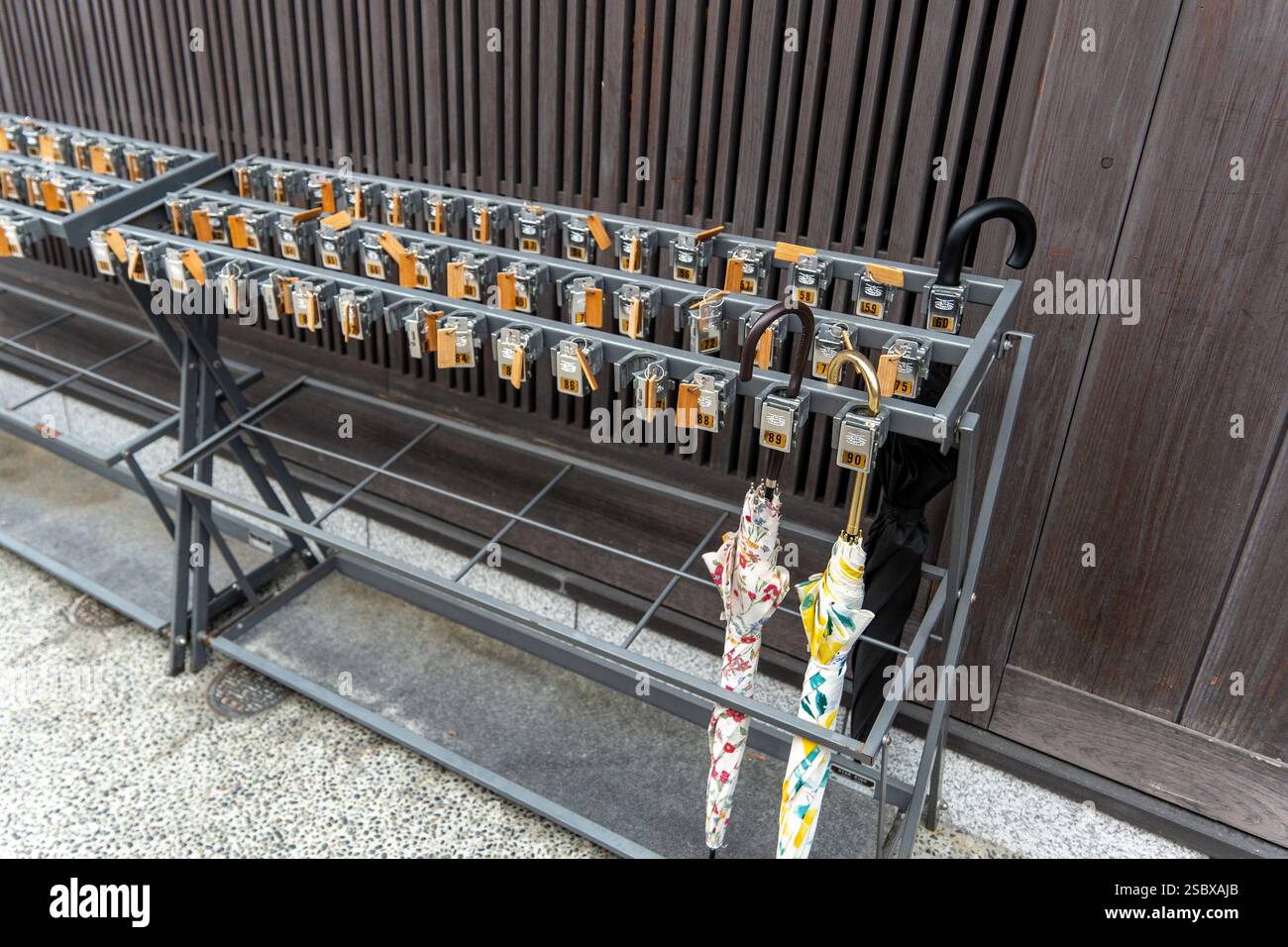 Visitors can find a well-organized umbrella stand featuring vibrant ...