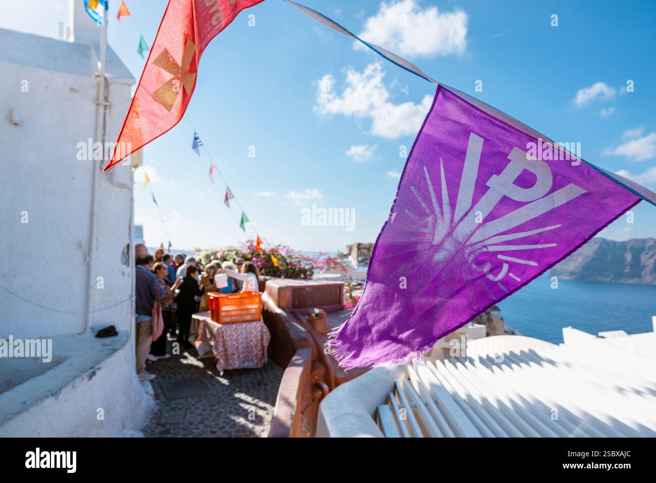Bags of food are distributed to the community in front of the church of ...