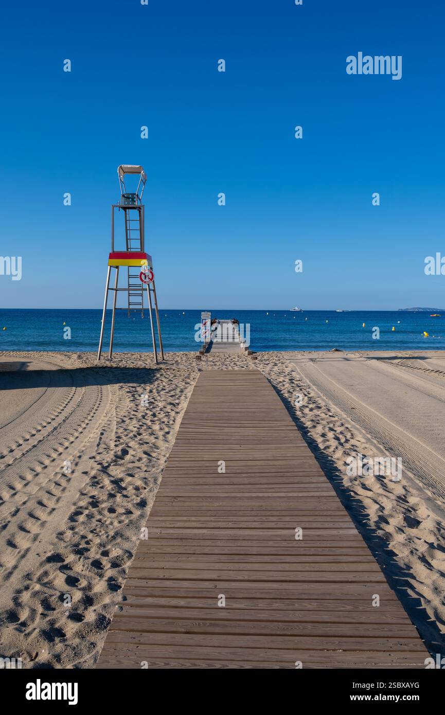 Morning view on crystal clear blue water and pier of Plage du ...