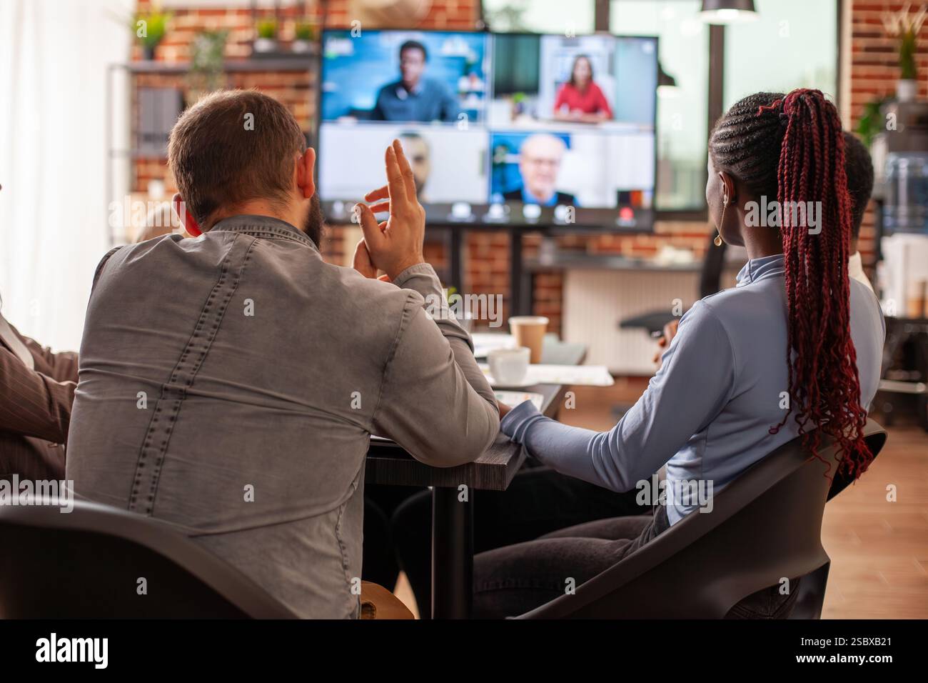 Business people collaborate remotely, discussing company strategies via ...