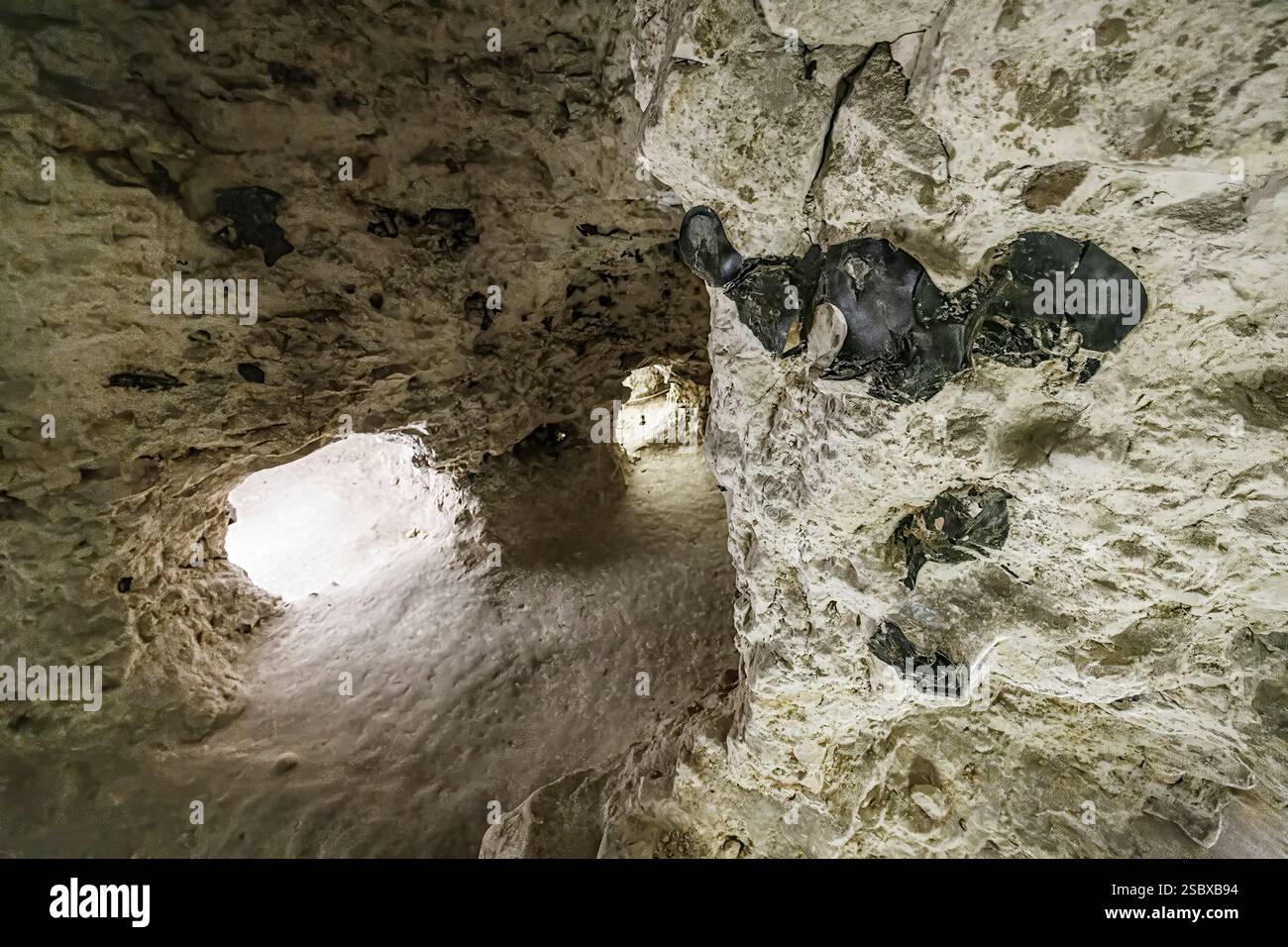 Underground tunnel with flint nodule in wall of Neolithic flint mines ...