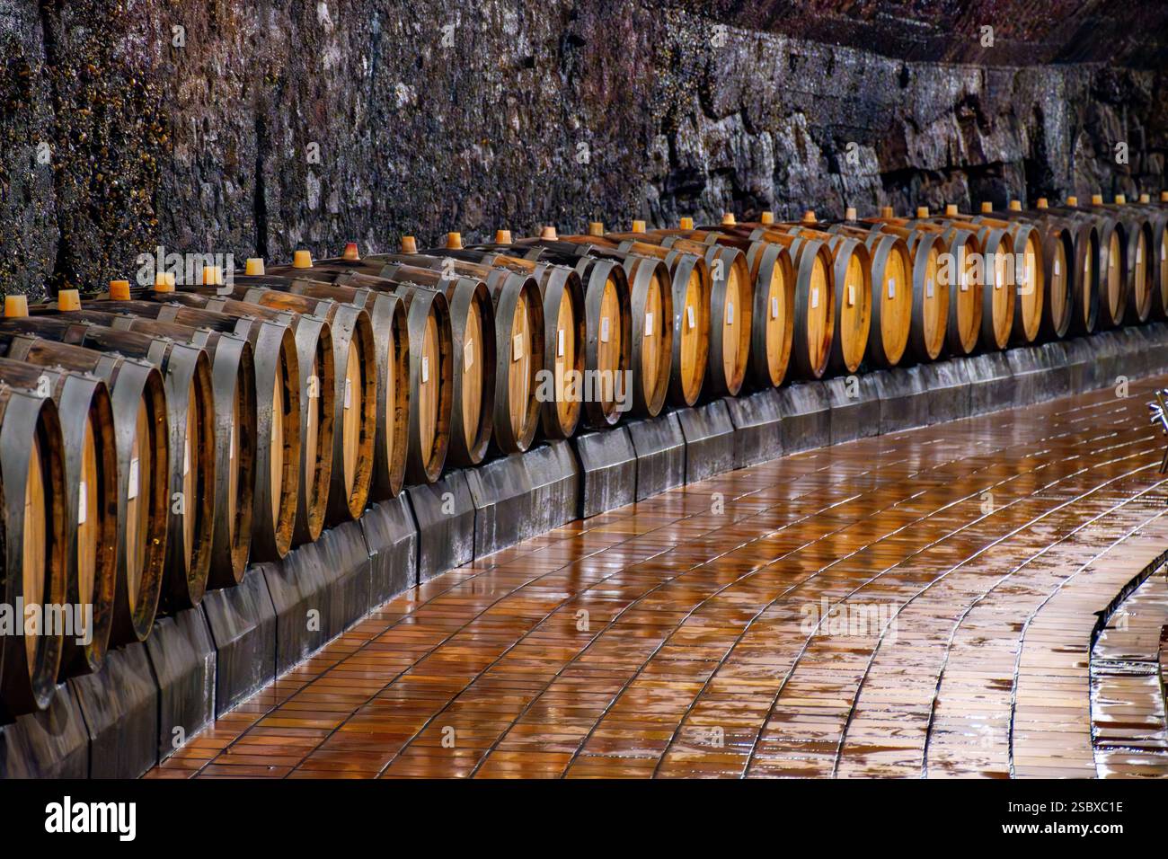 Second fermentation in barrels in caves, traditional method of ...
