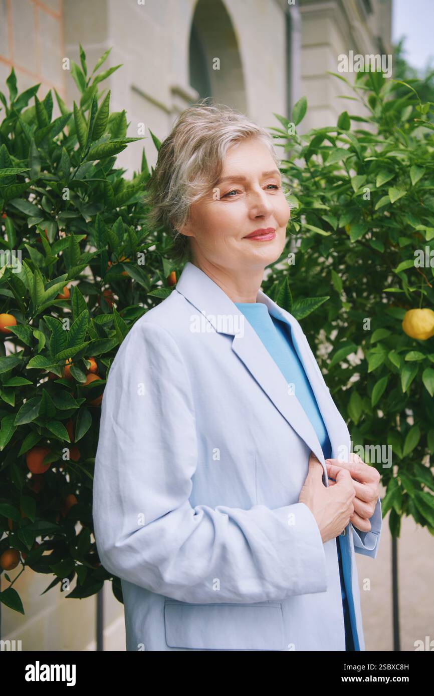 Outdoor mediterranian portrait of beautiful middle age woman posing ...