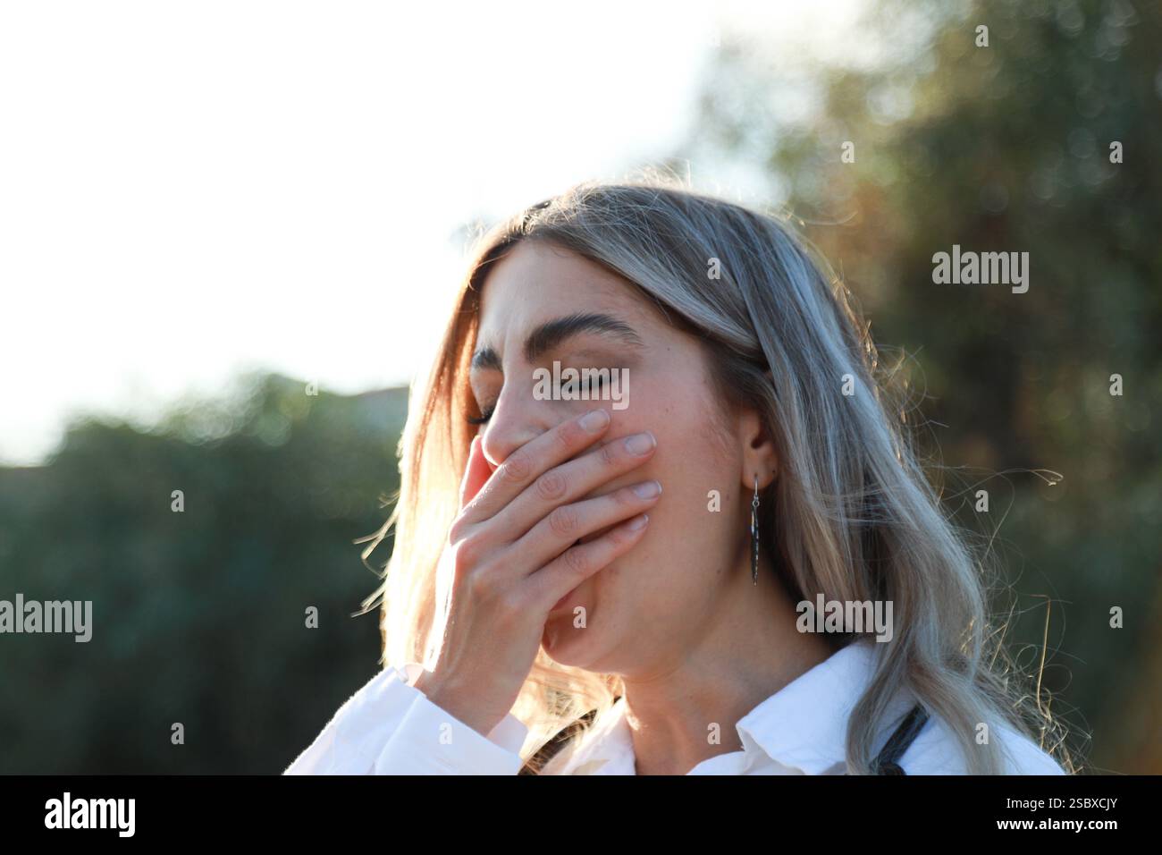 Overworked Doctor Catching Her Breath in Fresh Air Stock Photo - Alamy