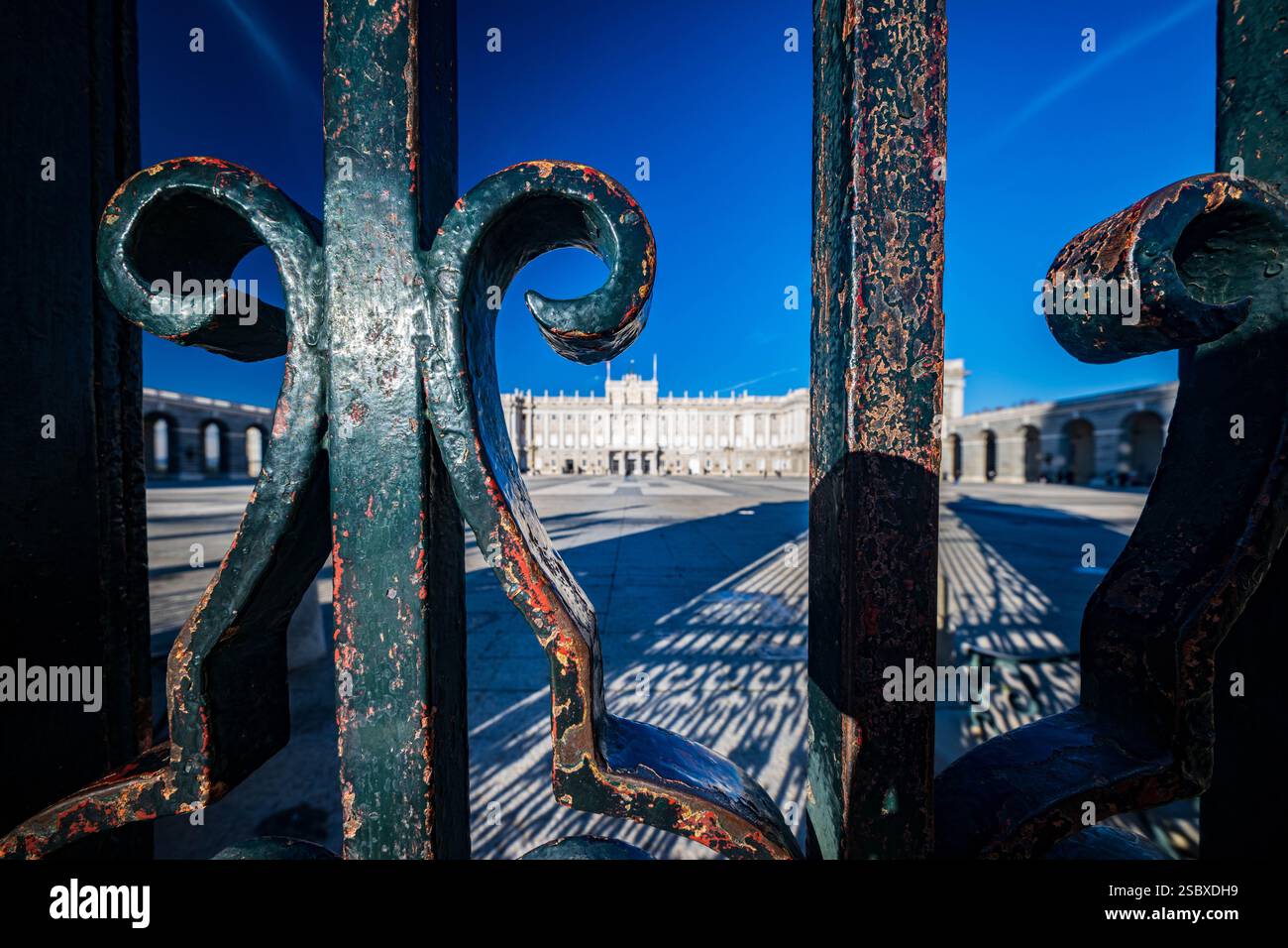 View through ornate metal gate at the iconic Royal Palace of Madrid ...