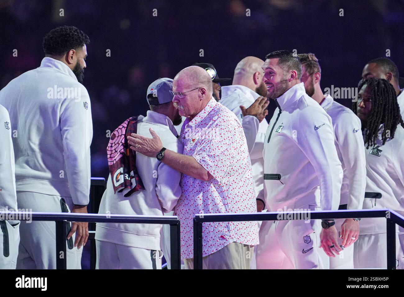 Chiefs head coach Andy Reid hugging Eagles players During the Super ...
