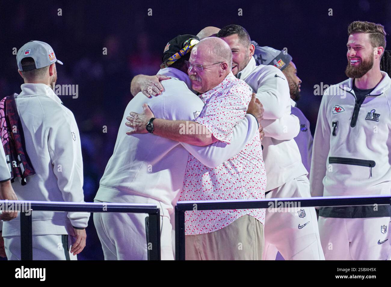 Chiefs head coach Andy Reid hugging Eagles players During the Super ...