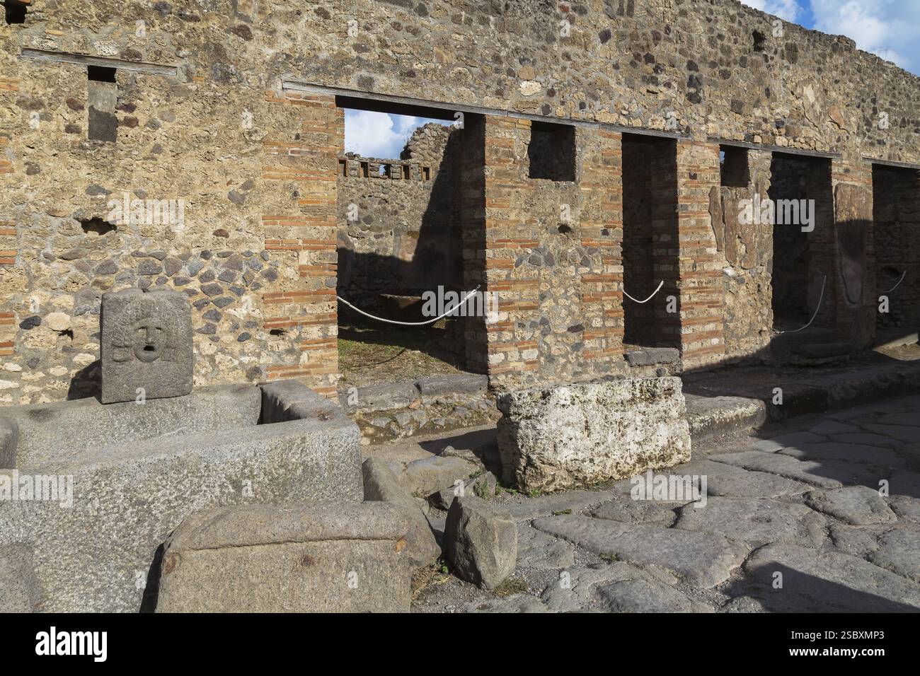 Doorways in old residential building made of terracotta brick and stone ...