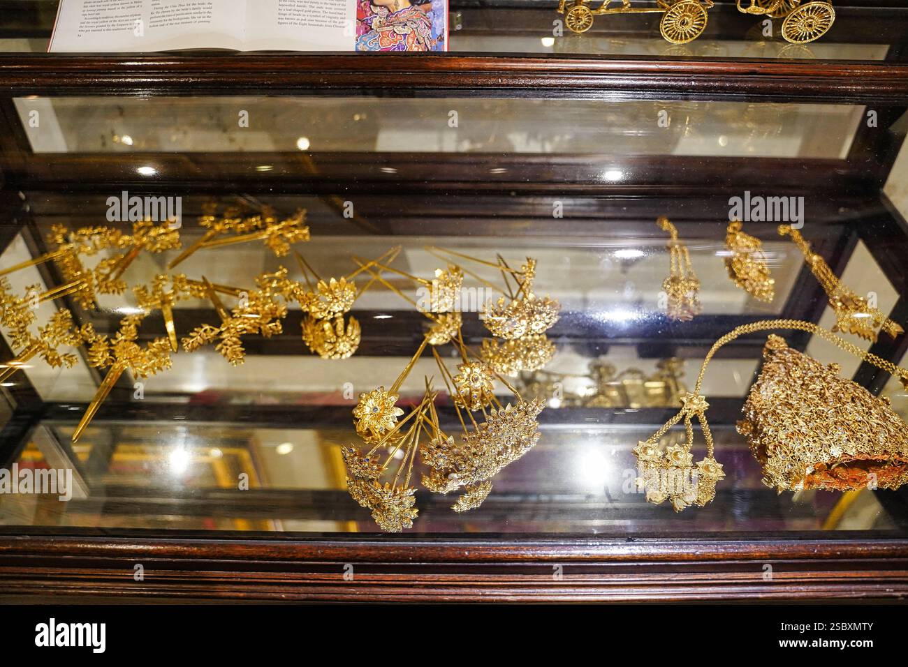 Diamond studded hair pins and hair piece ornaments in gold on display ...
