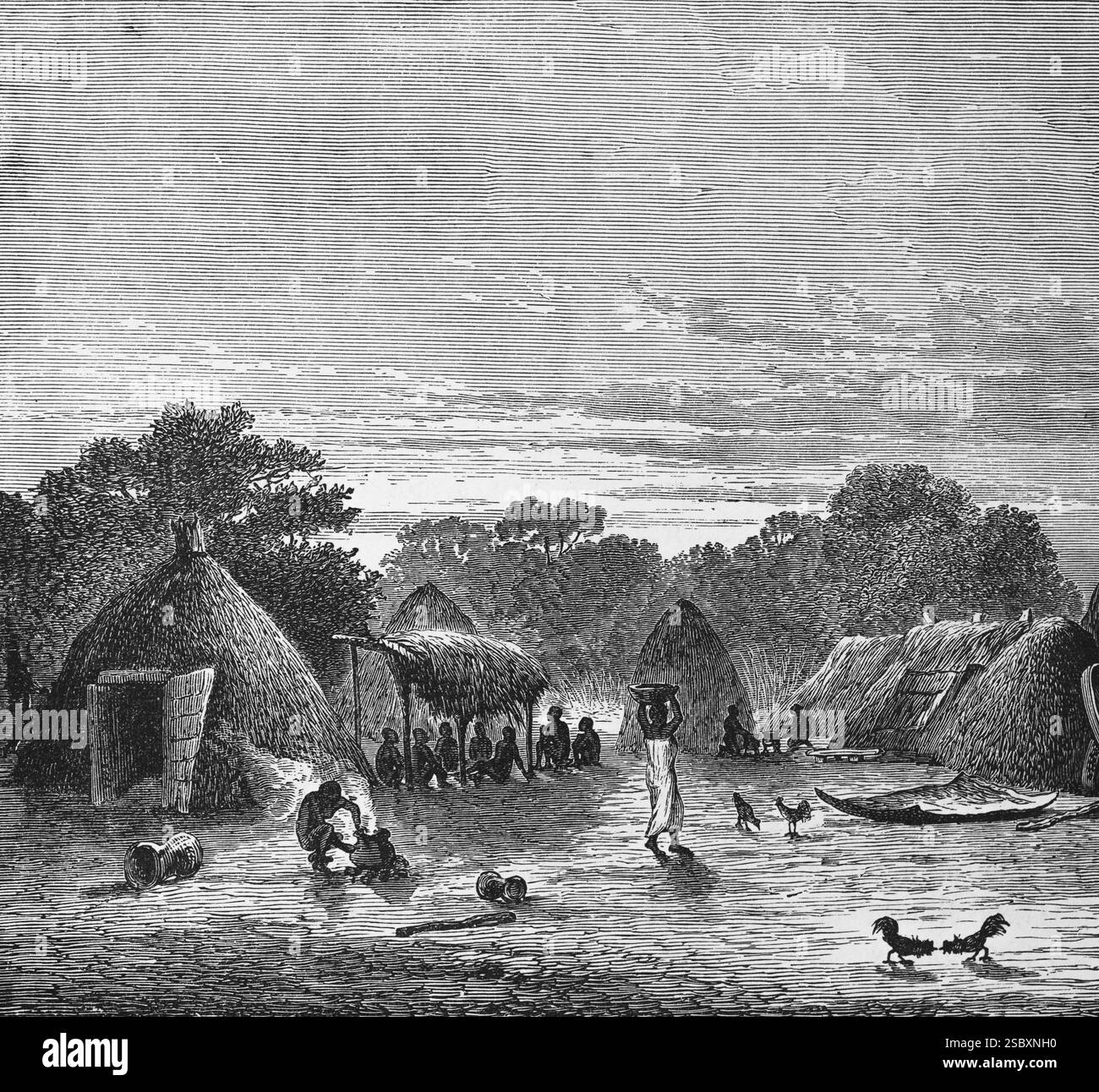 Village view with huts in the tropics, locals sitting in the shade ...