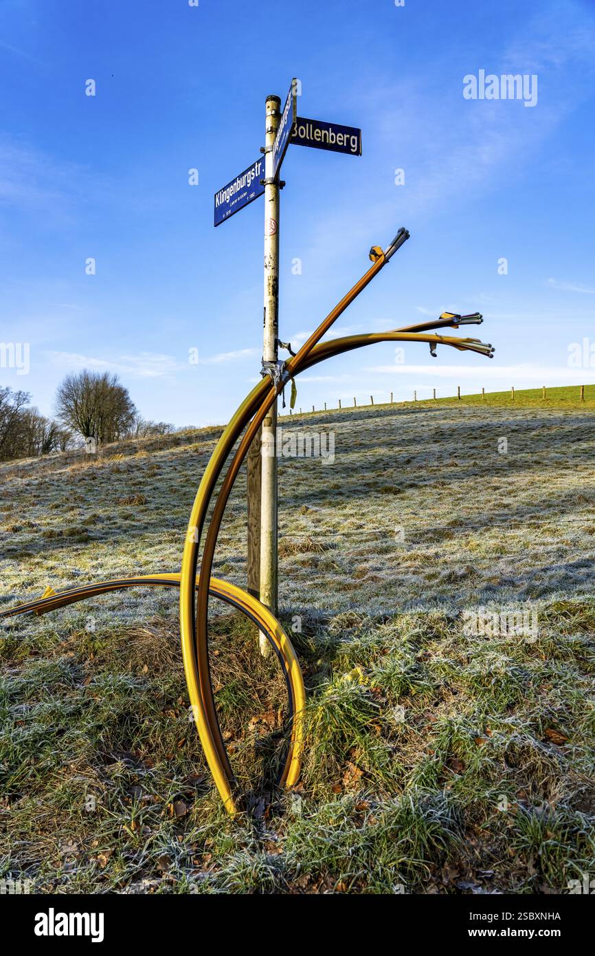 Fibre optic connection, empty conduits protrude from the ground along a ...