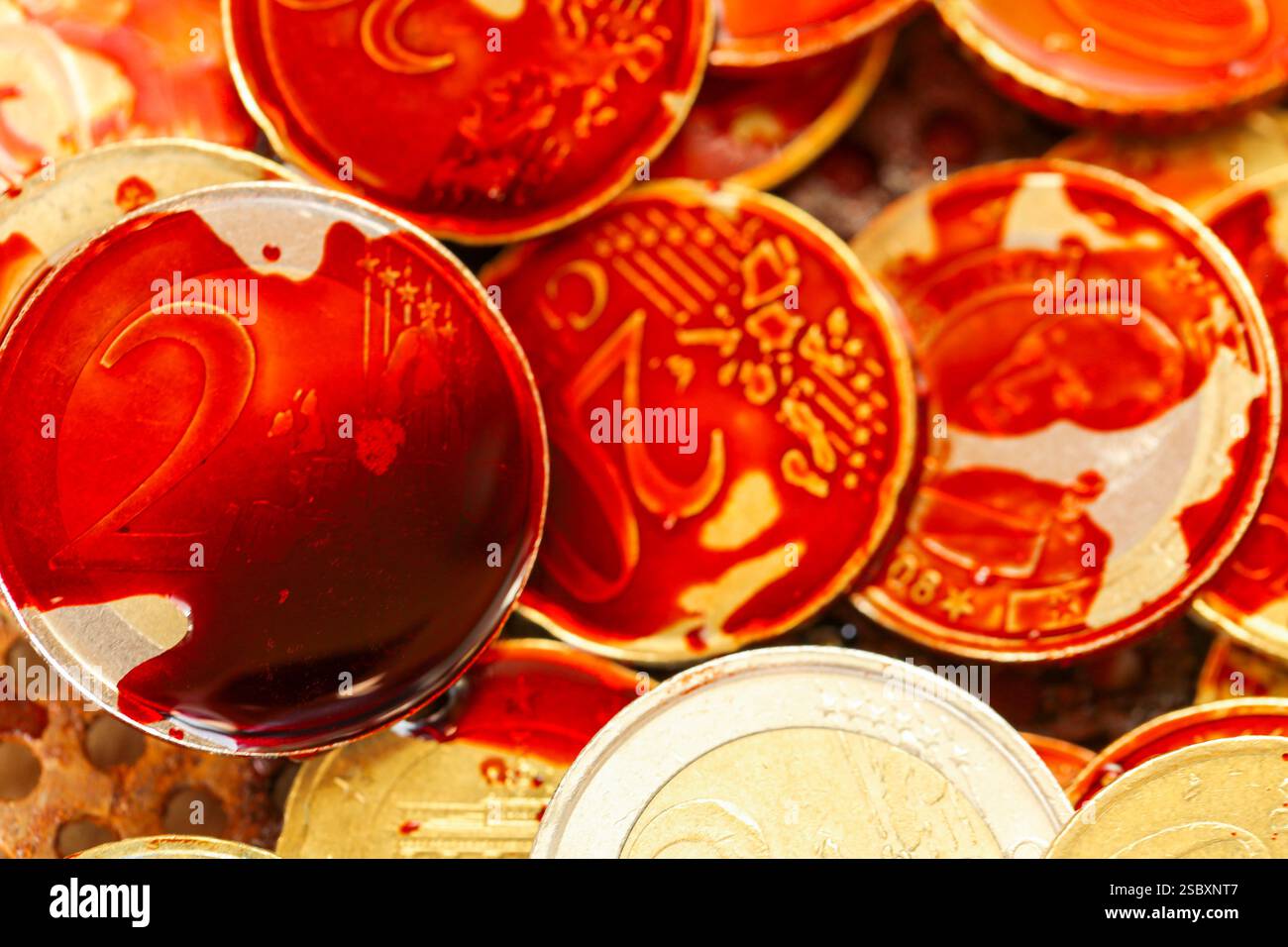Bloody criminal money.Symbol of dirty money. Euro coins in blood Stock ...