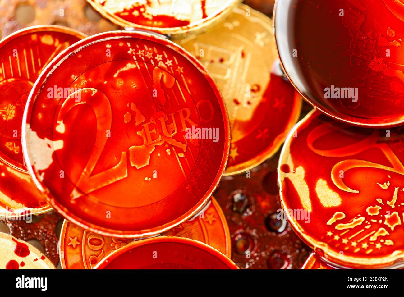 blood on coins close up.Bloody money background.Drops of red blood and ...