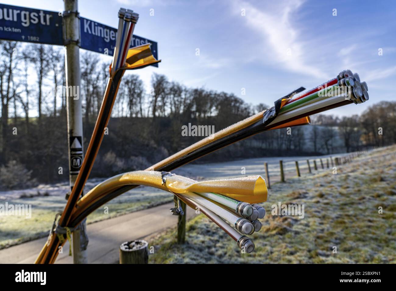 Fibre optic connection, empty conduits protrude from the ground along a ...
