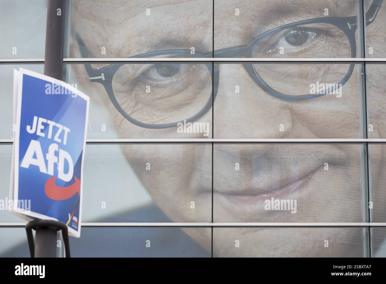 An election poster of the far-right AfD party (now AfD) hangs in front ...