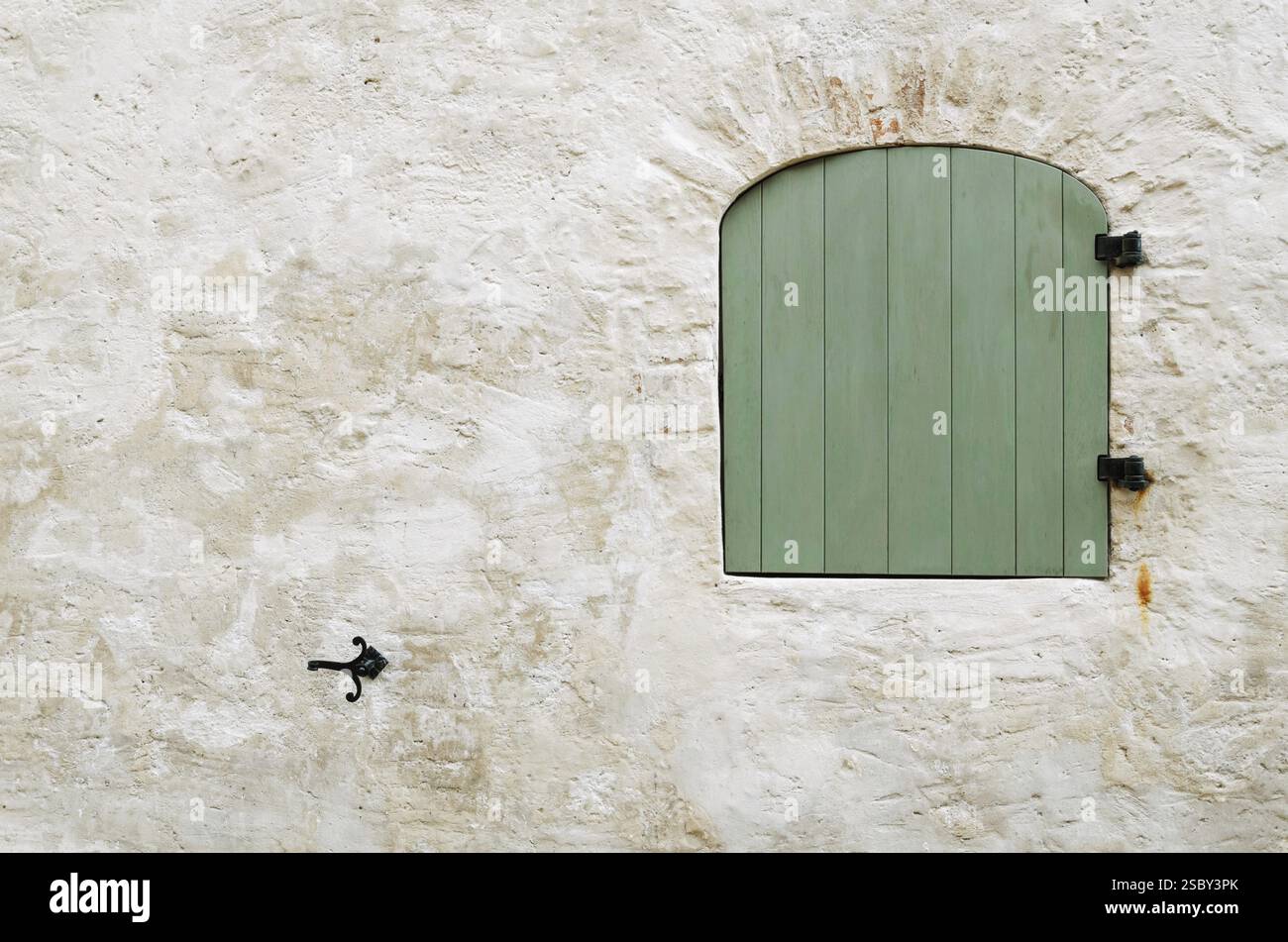 Closed Green Wooden Window Shutters In The Wall Stock Photo - Alamy