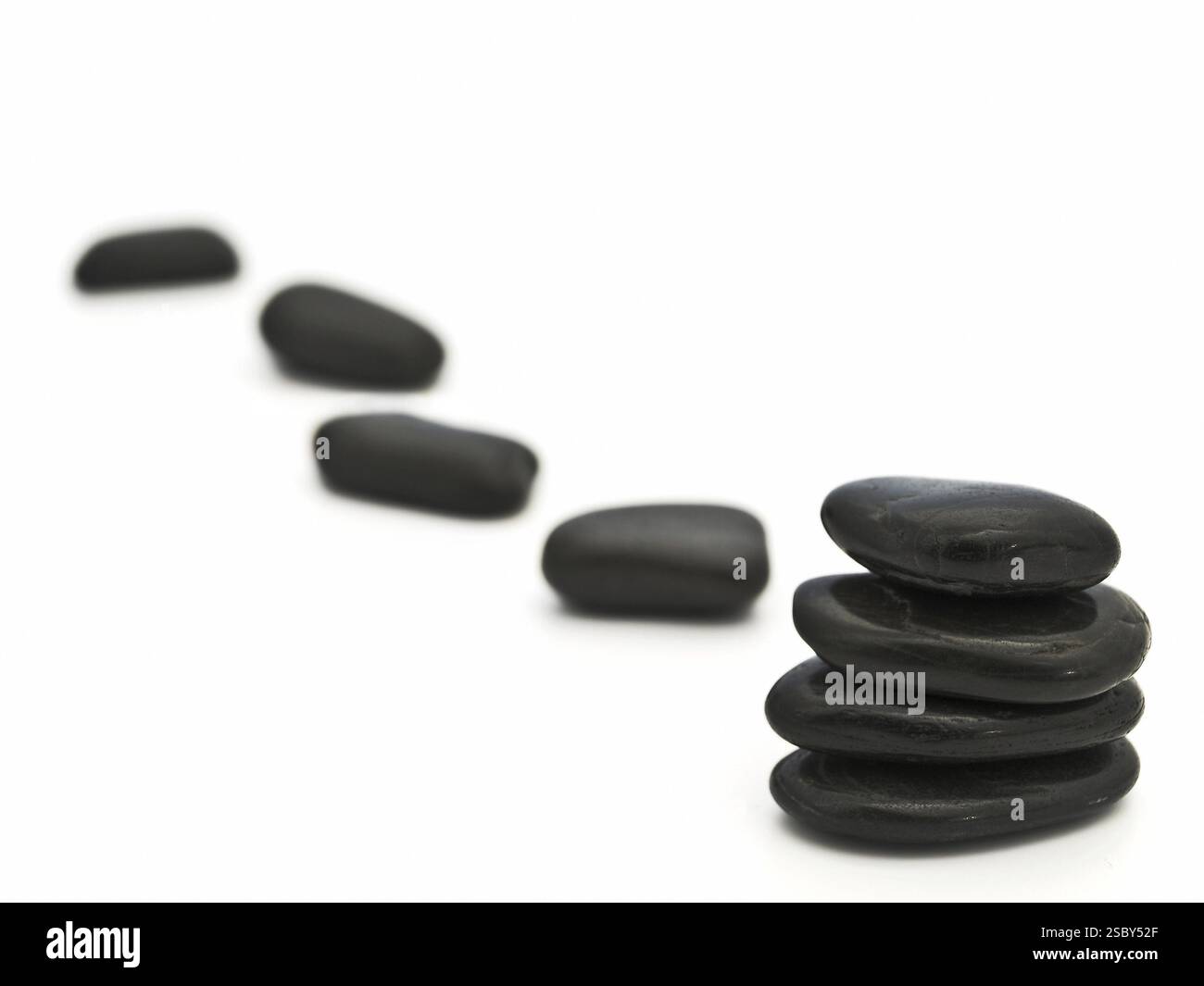 Relax theme with Zen stones over white background Stock Photo - Alamy