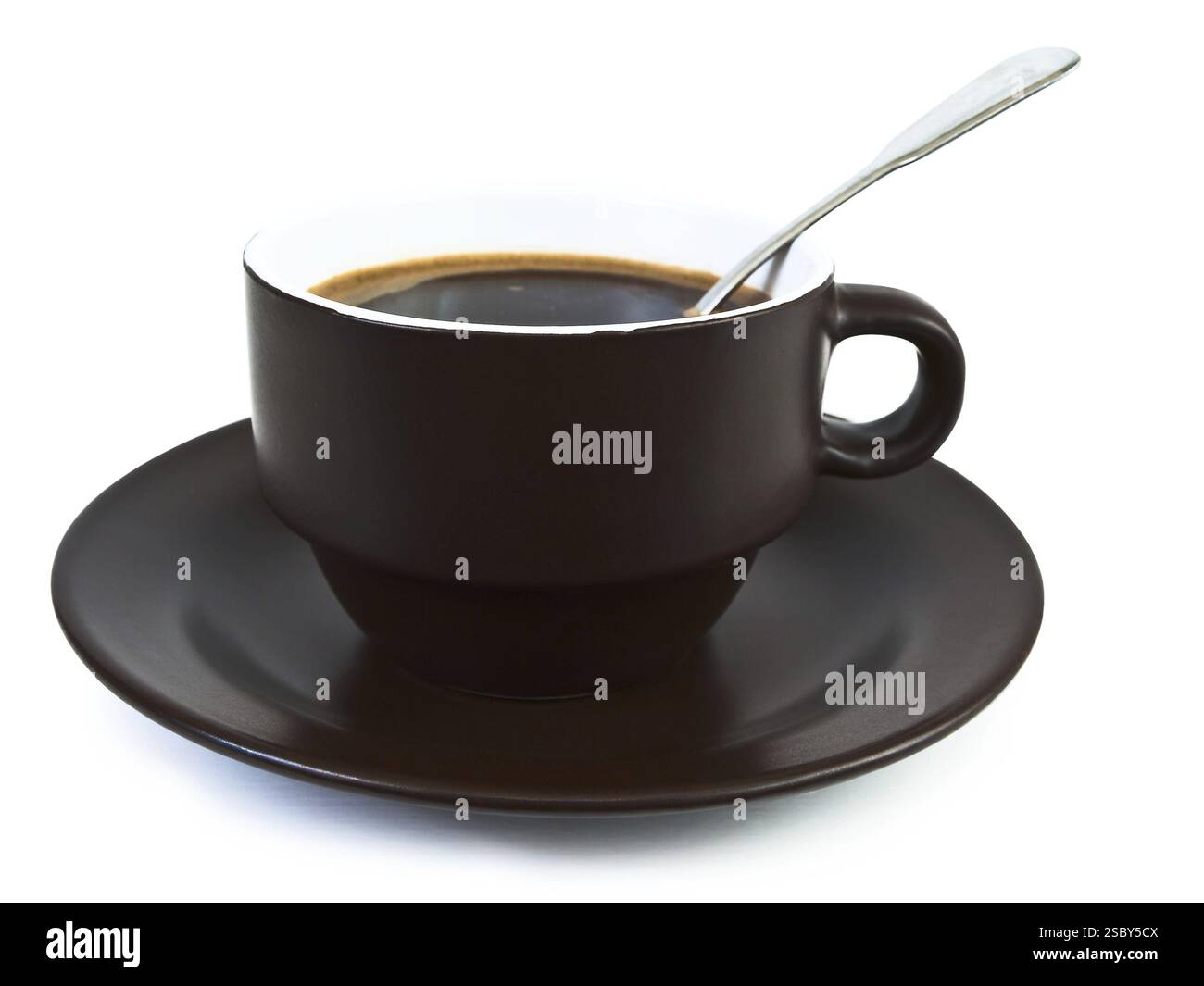 Brown color cup of coffee with spoon in it over the white background ...