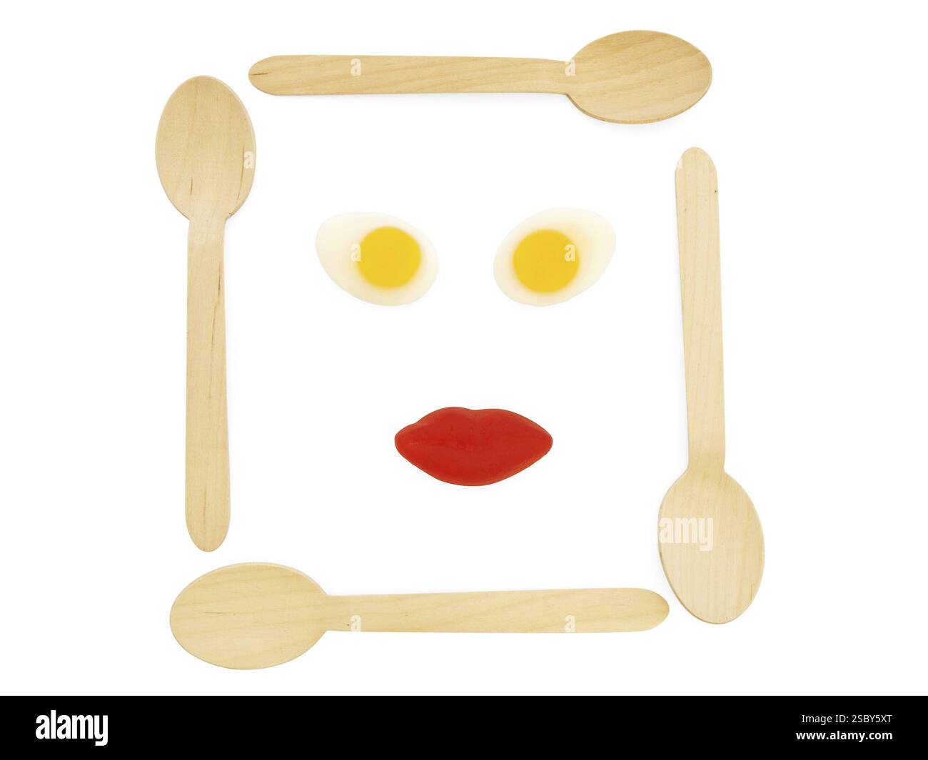 Wooden spoons with amazing colorful tasty jelly candies in woman face ...