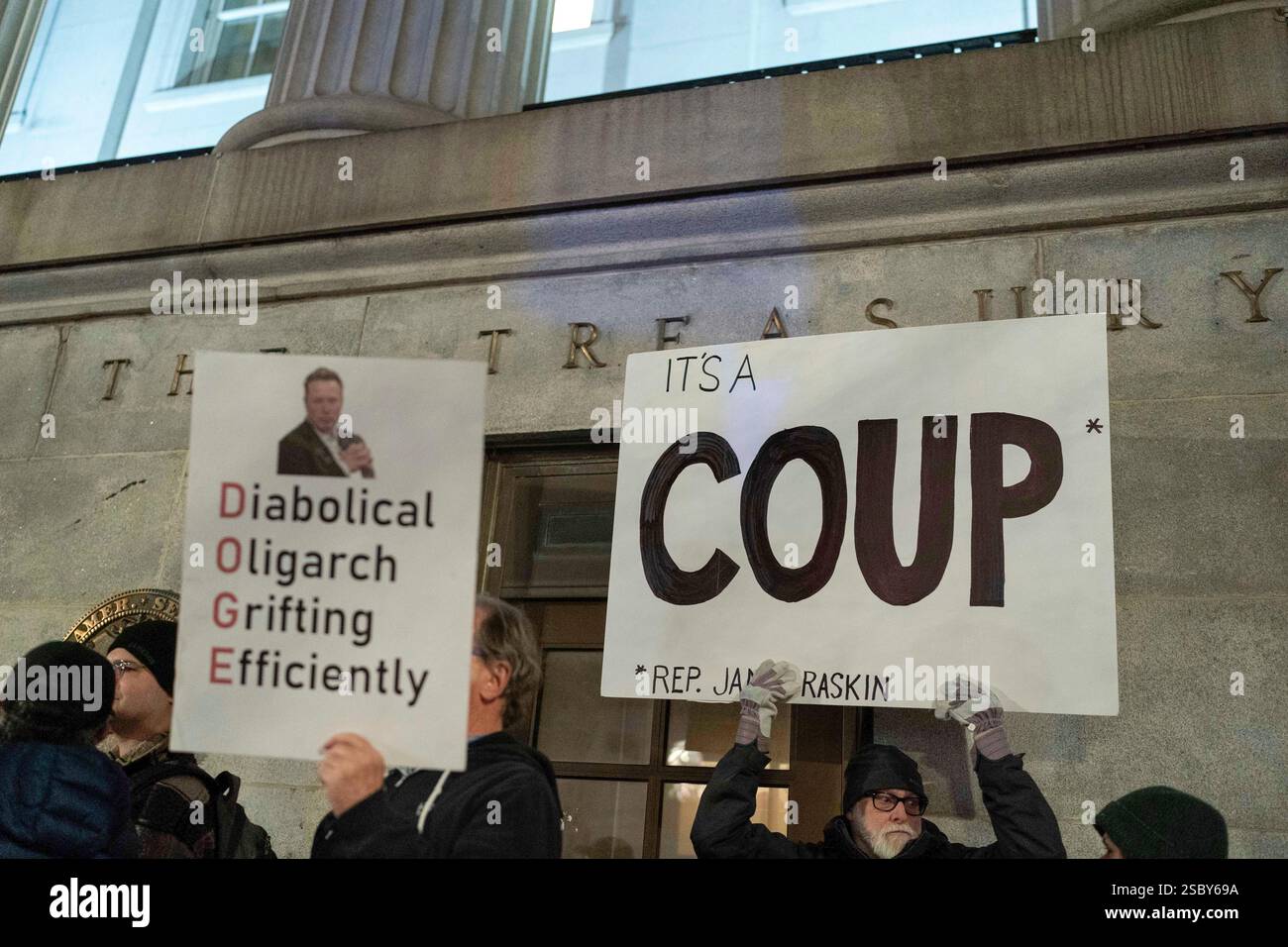People protest during a rally against Elon Musk outside the Treasury ...