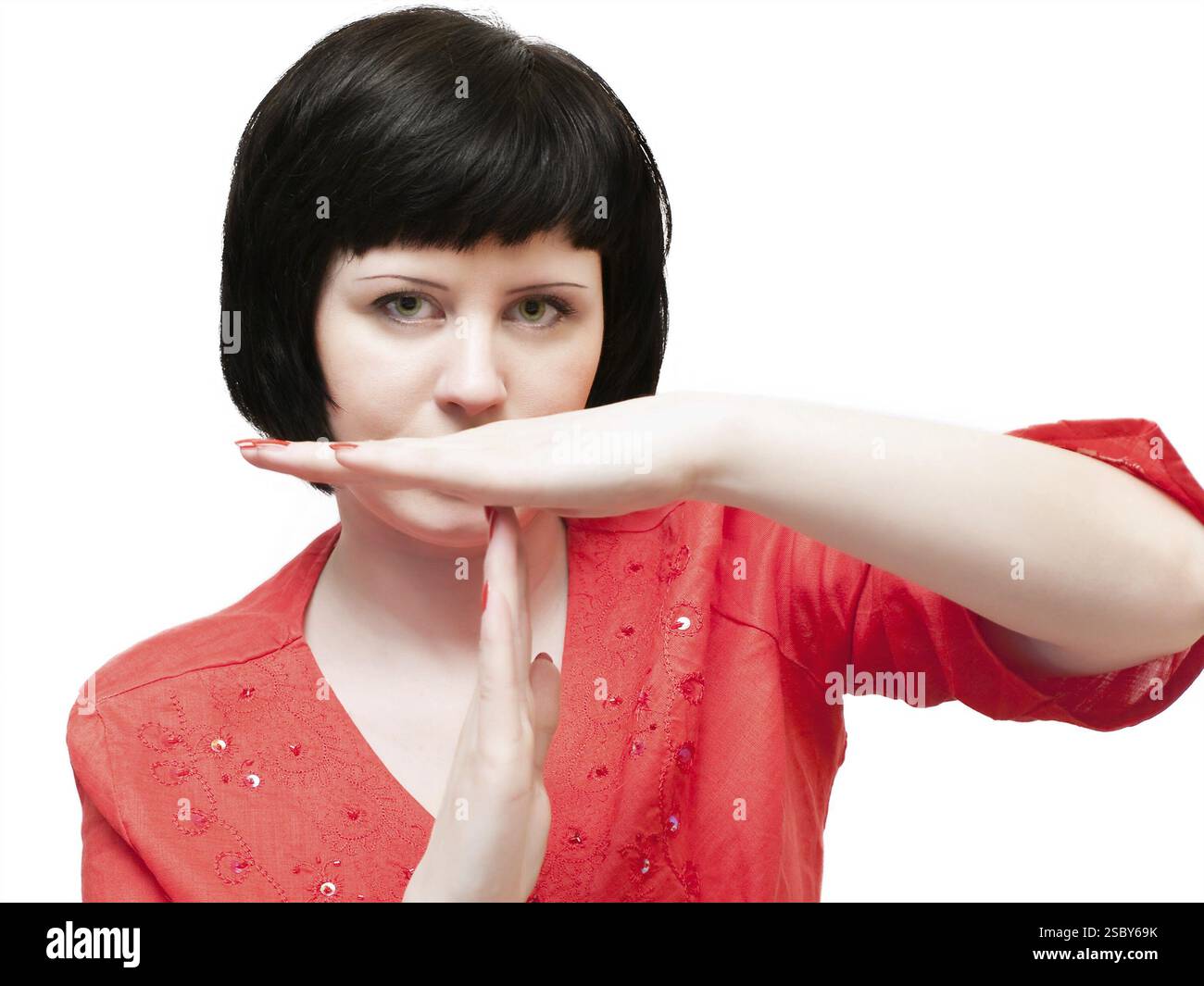 Woman show time out sign with her hands against the white background ...