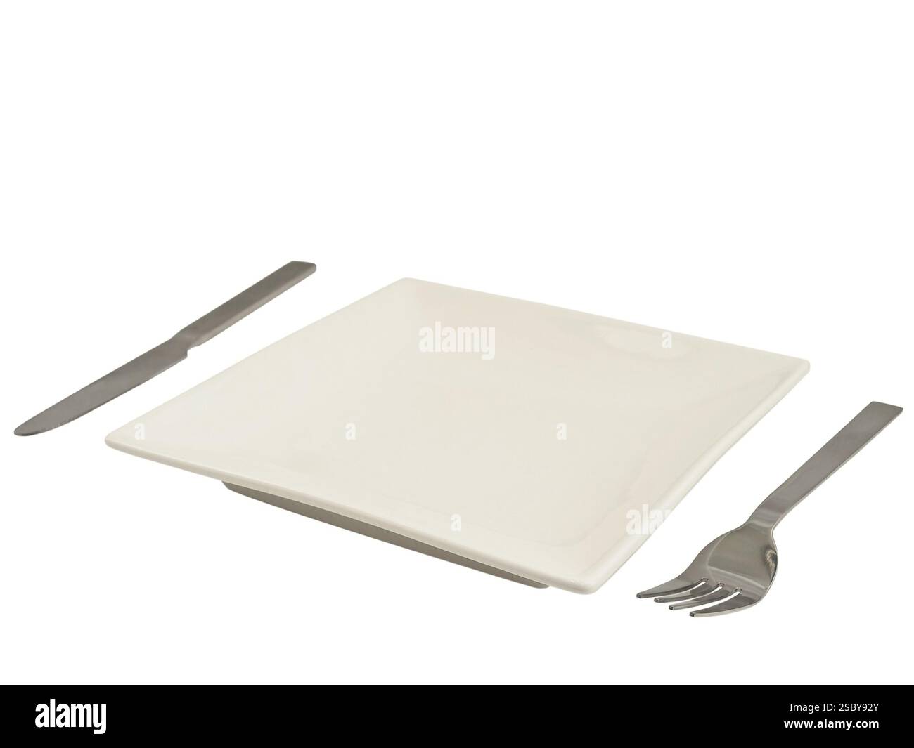 Plate, knife and fork against the white background Stock Photo - Alamy