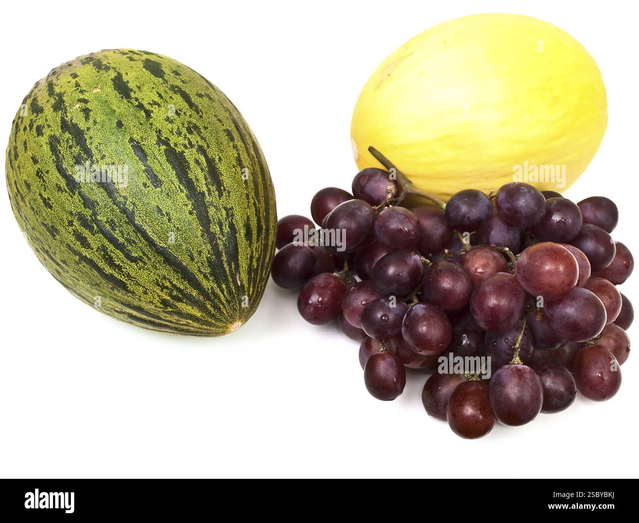 Melons and red grape against the white background Stock Photo - Alamy