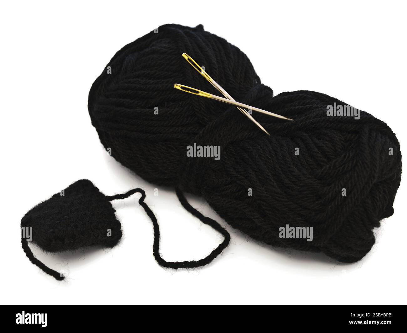 Two needles with golden needle's eye in the black clew Stock Photo - Alamy