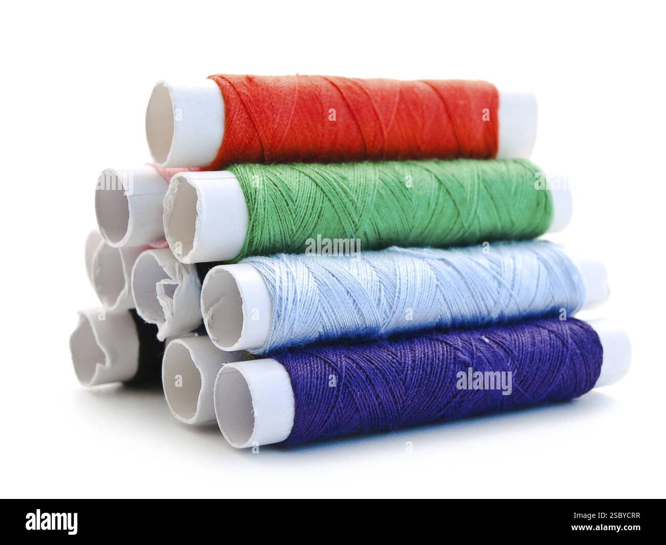 Different color threads over the white background Stock Photo - Alamy