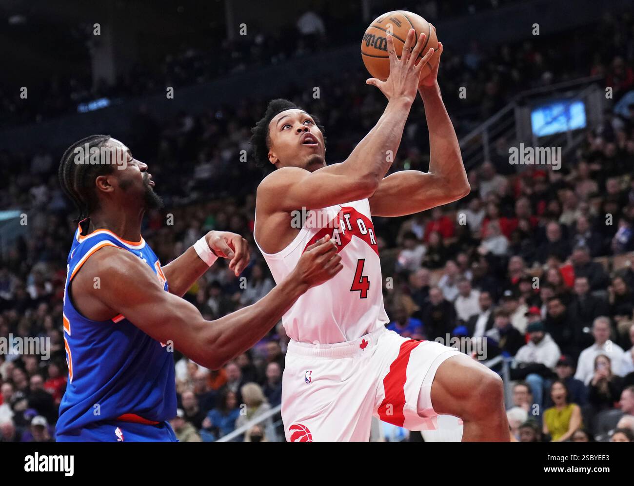 Toronto Raptors' Scottie Barnes (4) drives past New York Knicks' Ariel ...