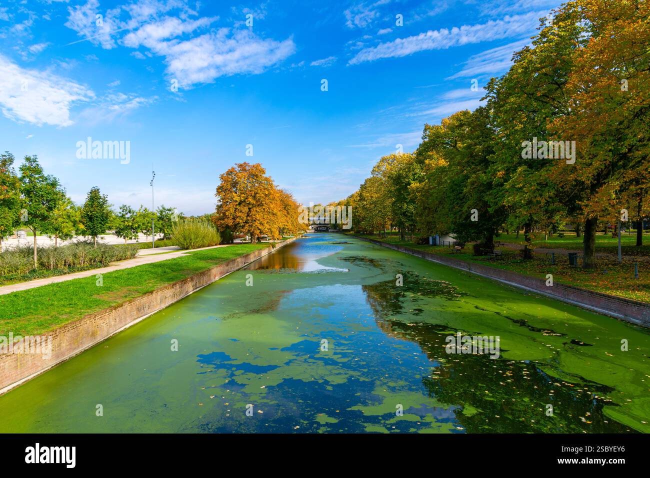 Canal de la Deûle, with the leaves of the trees turning yellow in the ...