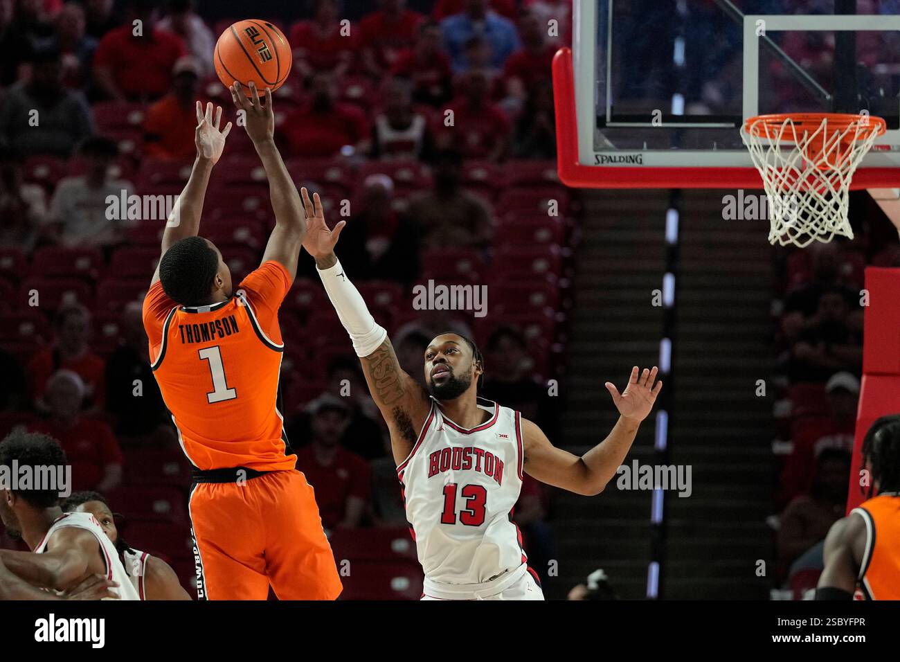 Houston forward J'Wan Roberts (13) defends Oklahoma State guard Bryce ...