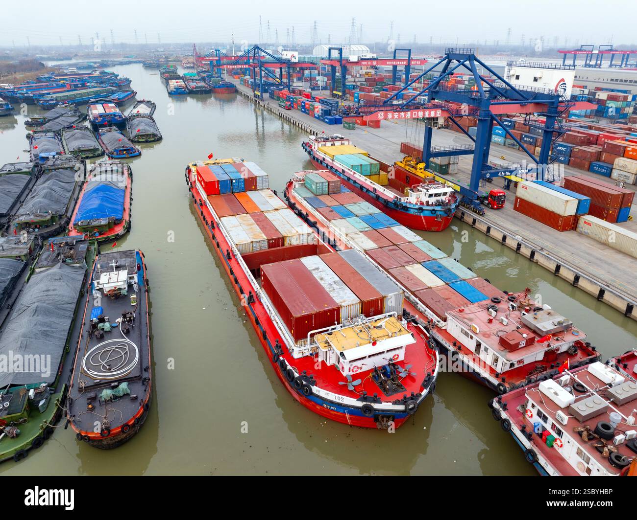 HUAI'AN, CHINA - FEBRUARY 5, 2025 - Cargo ships are docked for loading ...