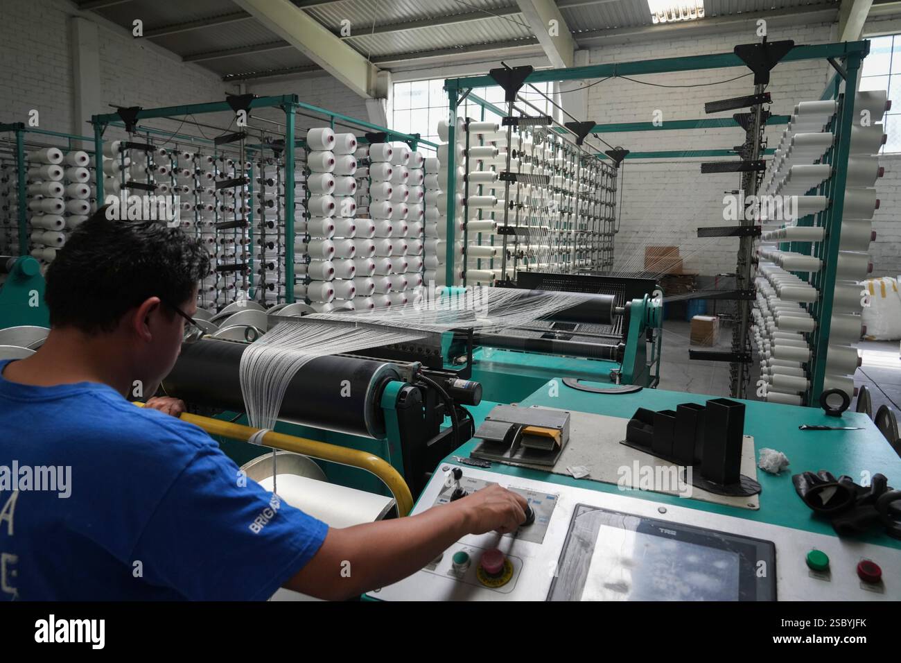 An employee works at a textile factory in Tlaxcala, Mexico, Tuesday ...